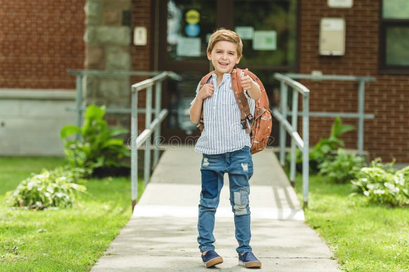 Smart Little Child with Backpack on the School Playground. Stock Image ...