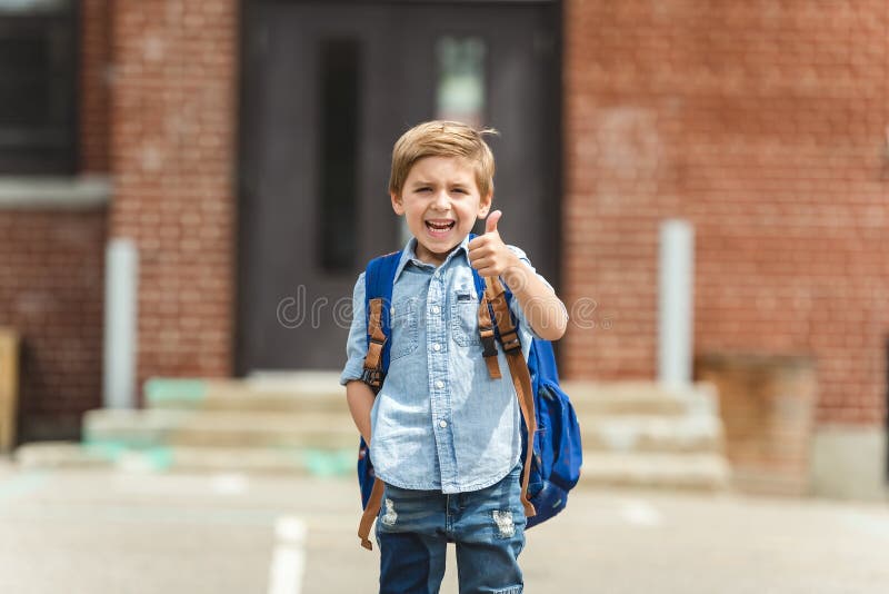 Smart Little Child with Backpack on the School Playground. Stock Photo ...