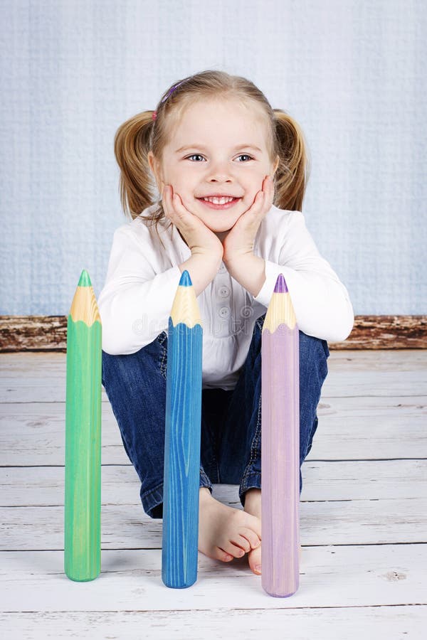 Smart Little Girl Holding Big Crayons Stock Photo - Image of childhood ... Smart Little Girl Holding Big Crayons Stock Photo - Image of childhood ...