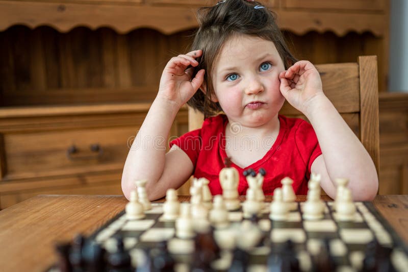 A Smart Little Girl Playing Chess Stock Image - Image of game ...
