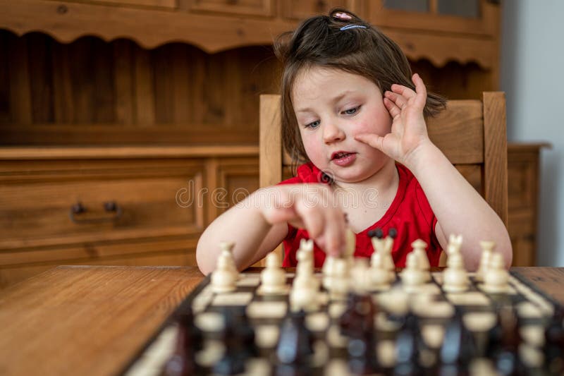 A Smart Little Girl Playing Chess Stock Image - Image of learning ...