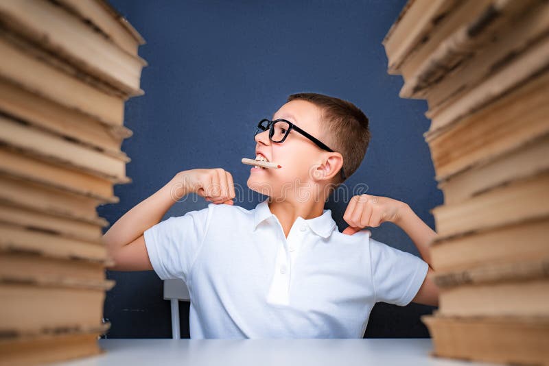 Smart Looking Boy Holding Pencil in His Hand, Looking Away and T Stock ...