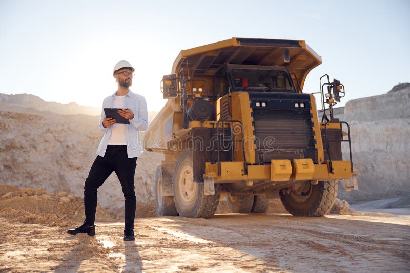 Smart Man in Glasses and in Uniform is Working in the Quarry at Daytime ...