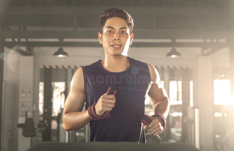 Smart Man Running on Treadmill in Gym. Stock Photo - Image of indoors ...