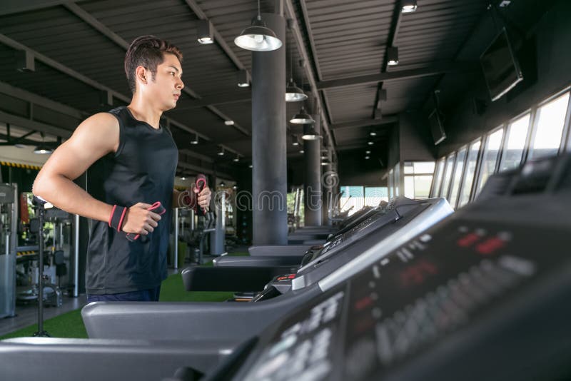 Smart Man Running on Treadmill in Gym. Stock Photo - Image of active ...