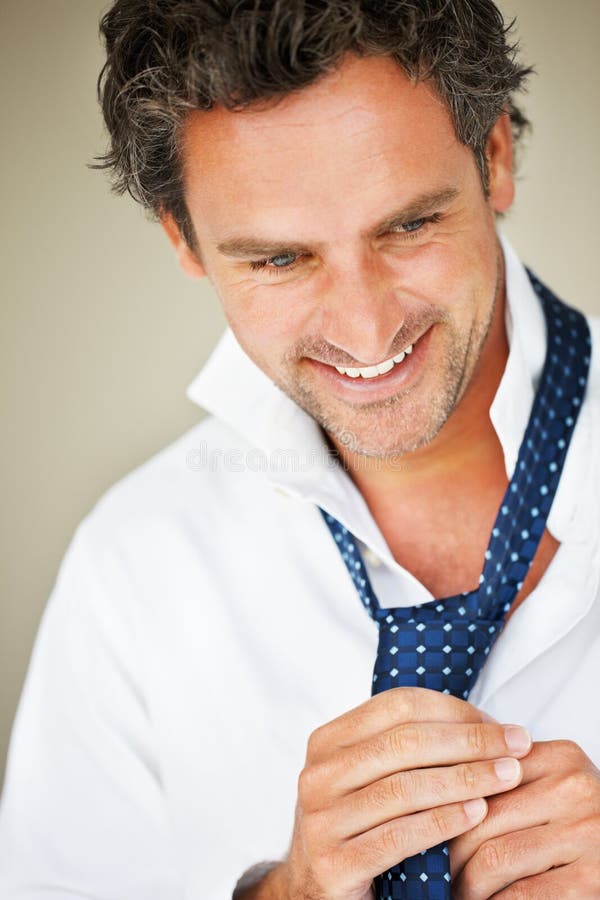 Smart Man Wearing Tie. Closeup of Smart Man Wearing Tie and Smiling ...