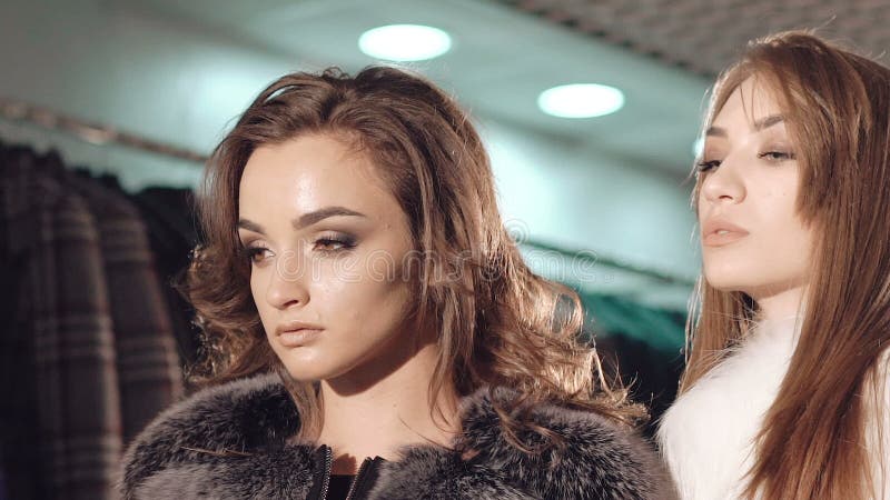 Smart Models Stands in Pose in the Rich Fur Coats for Advertising ...