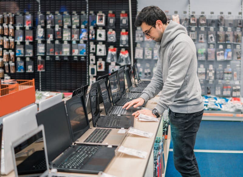 Modern Male Customer Choosing Laptop in the Computer Store Stock Image ...