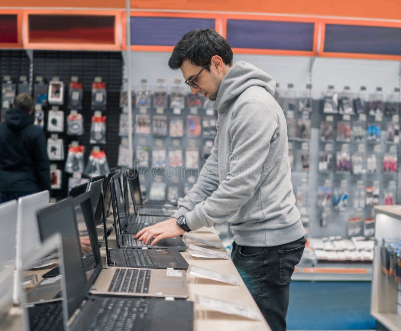 Modern Male Customer Choosing Laptop in the Computer Store Stock Image ...