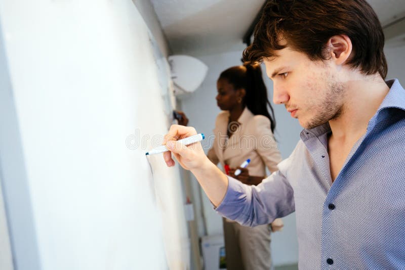 Smart People Writing on Whiteboard Stock Photo - Image of company ...