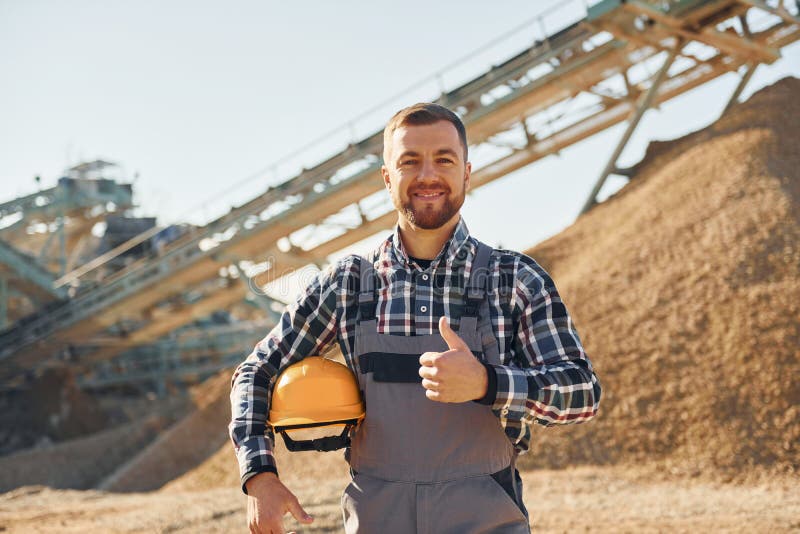 Smart Person. Construction Worker in Uniform is on the Quarry Stock ...