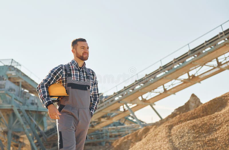 Smart Person. Construction Worker in Uniform is on the Quarry Stock ...