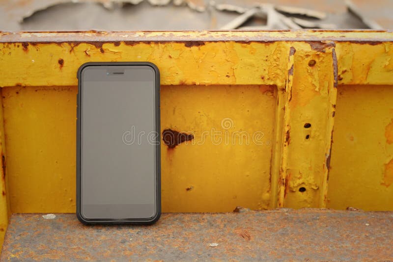 Smart Phone on Background of Yellow Steel. Stock Photo - Image of ...