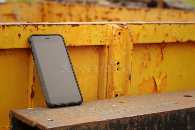 Smart Phone on Background of Yellow Steel. Stock Image - Image of ...