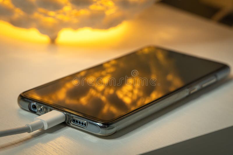 Smart Phone Charging with Usb Cable on the White Table Stock Photo ...