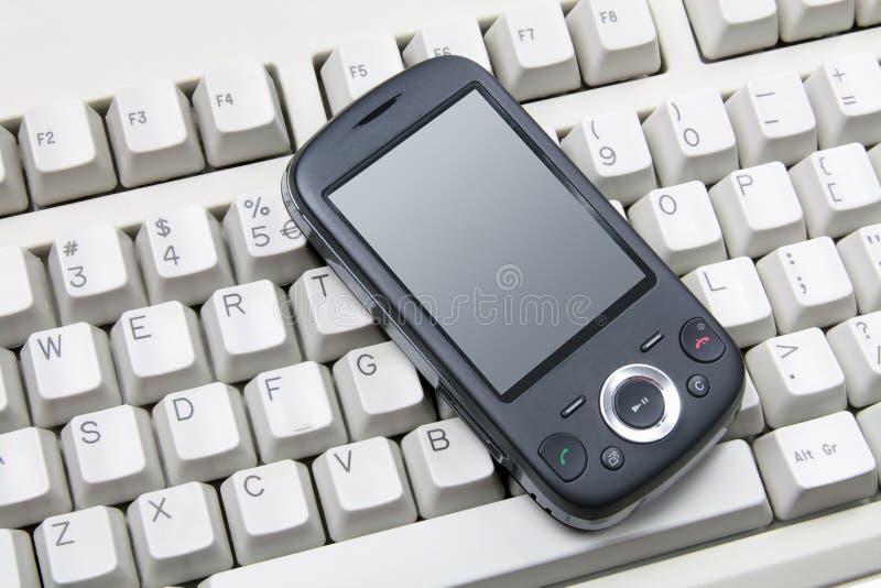 Smart Phone on Computer Keyboard Stock Photo - Image of connection ...