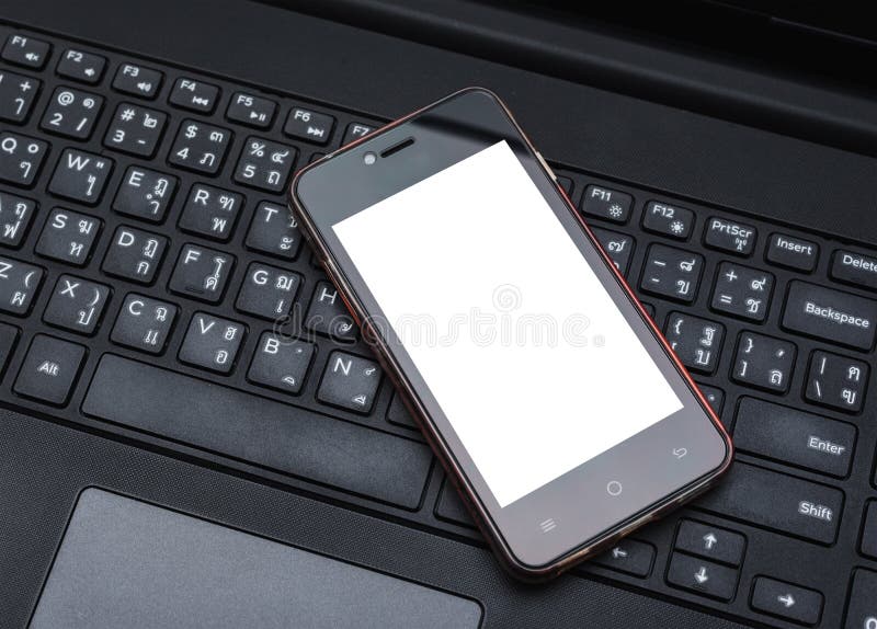 Smart Phone on Computer Notebook Stock Image - Image of information ...