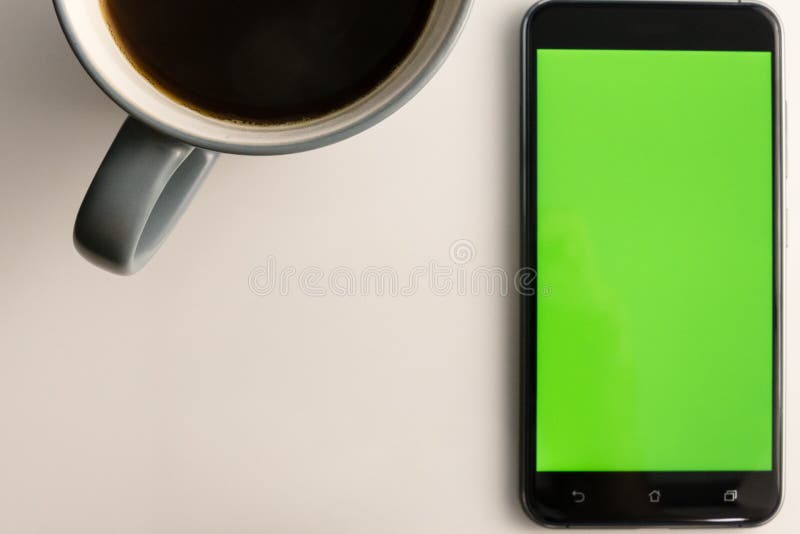 Smart Phone with Green Screen Next To Coffee Cup Stock Image - Image of ...
