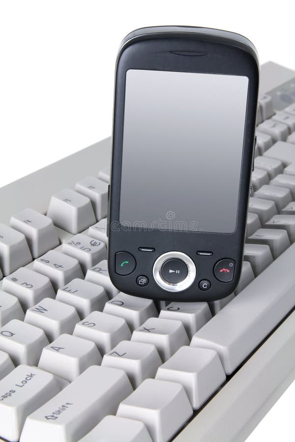 Smart Phone on Keyboard stock image. Image of digital - 25742575