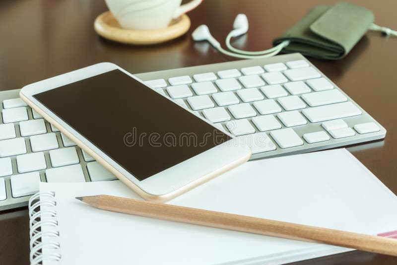 Smart Phone on Keyboard and Notepad with Pencil Stock Image - Image of ...