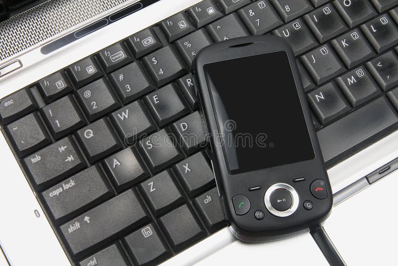 Smart Phone on Laptop stock photo. Image of call, networking - 23326494