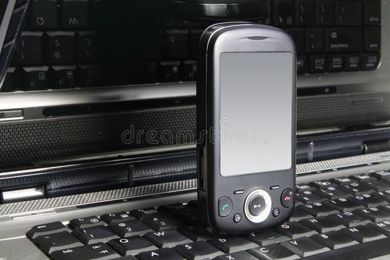 Smart Phone on Laptop Computer Stock Photo - Image of internet, online ...