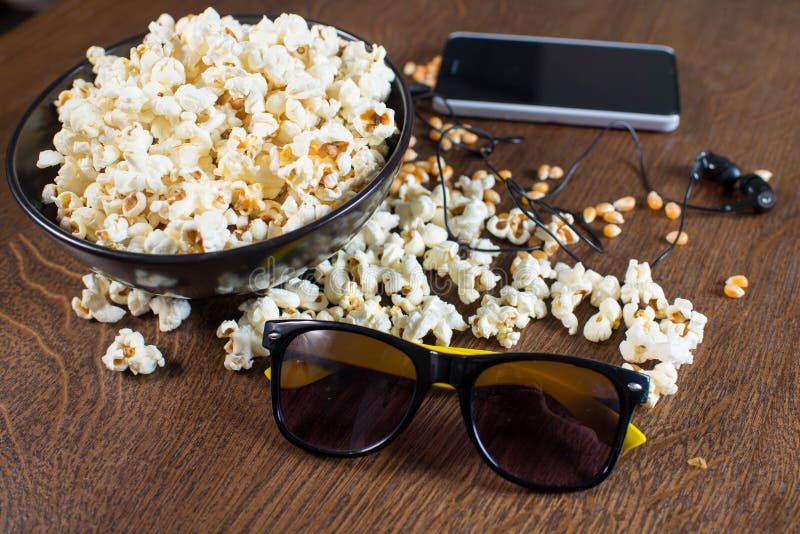 Smart Phone and Plate with Popcorn on the Wooden Table Stock Photo ...