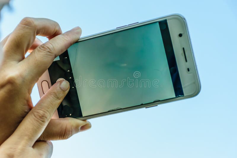 Smart phone shooting stock image. Image of hand, sunny - 102155999