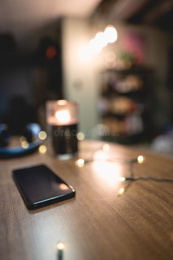 Smart Phone on Table with Decor Stock Image - Image of candle ...