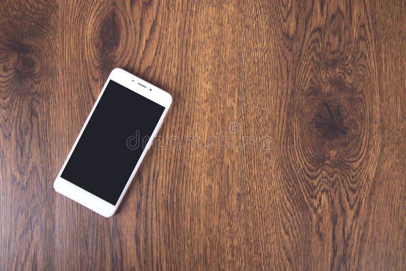 Smart phone on the table stock image. Image of communication - 184053711
