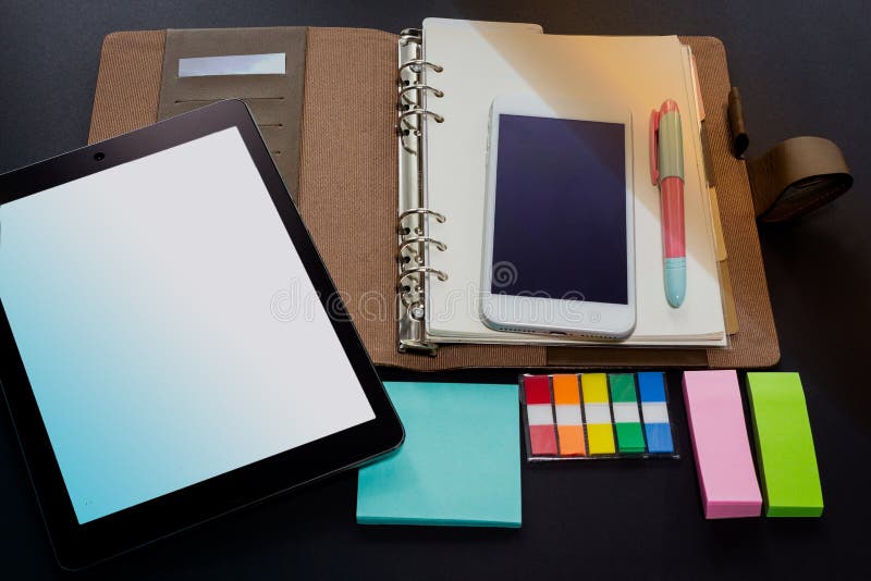 Mobile Phone and Tablet with Note Pads on Blank Ring Binder Planner on ...