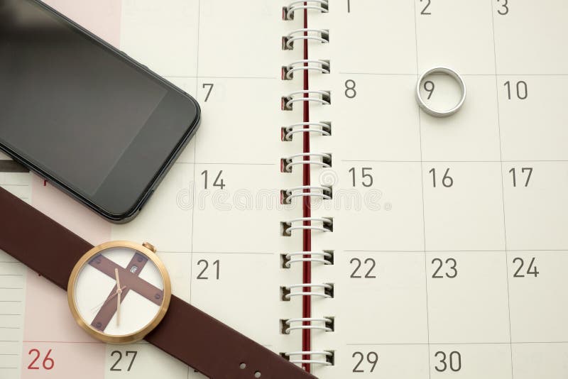 Smart Phone,watch and Silver Ring Put on Desktop Calendar Stock Photo ...