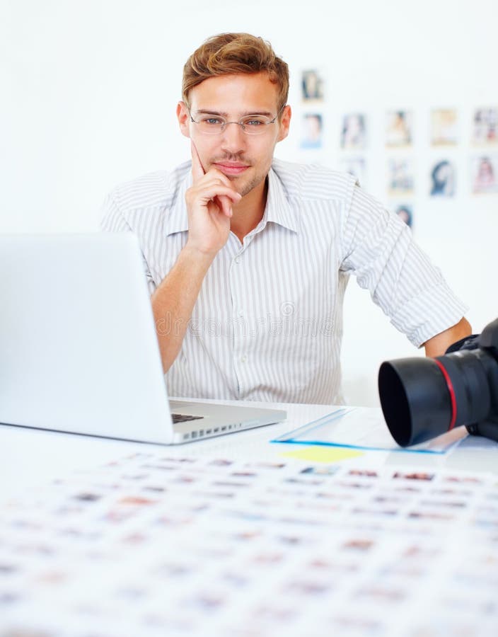 Smart Photographer. Portrait of Smart Photographer Using Laptop and ...
