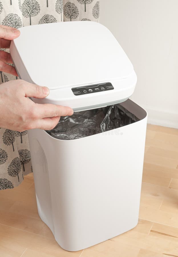 Smart Recycle Bin. Electronic Gadget for Home and Office. a Man`s Hand ...