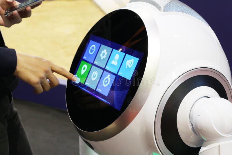 Smart Robot for Help Around the House. Male Hand Adjusts the Settings ...