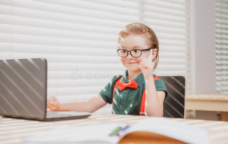 Smart School Boy at Home Writing Homework. Little Student with Notebook ...