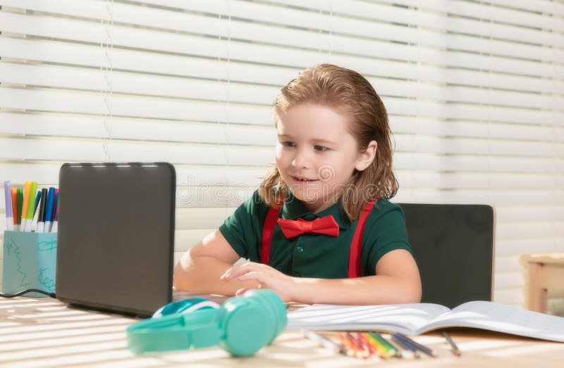 Smart School Boy at Home Writing Homework. Little Student with Notebook ...