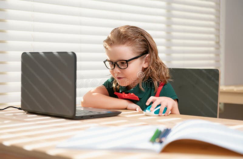 Smart School Boy Writing Homework Using Notebook Computer To Study ...