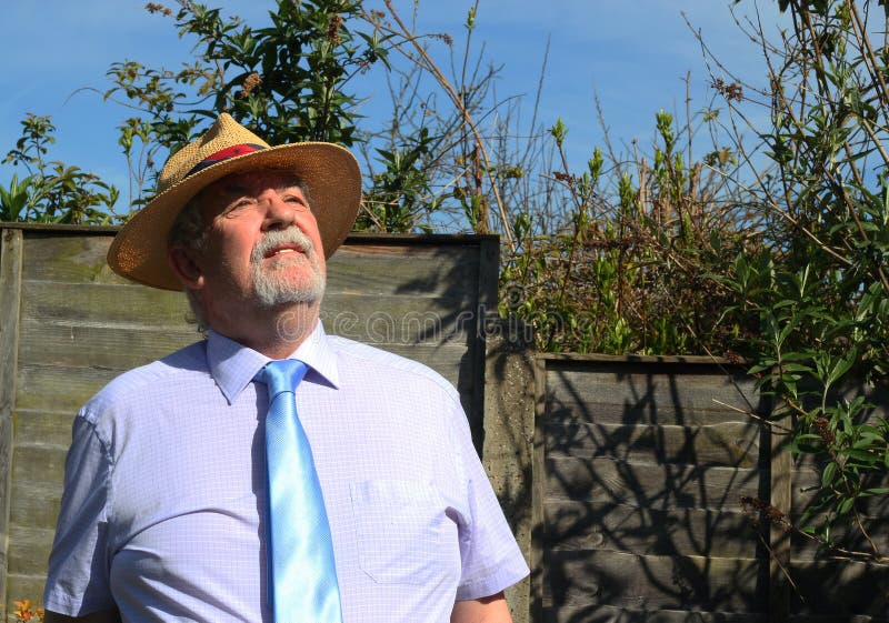 Smart Senior Man Wearing a Straw Hat Looking Up. Stock Image - Image of ...