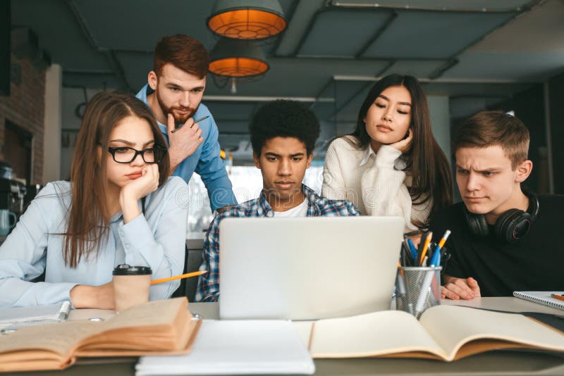 Smart Serious Students Working on Project in Front of Laptop Stock ...
