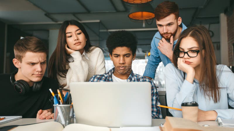 Smart Serious Students Working on Project in Front of Laptop Stock ...