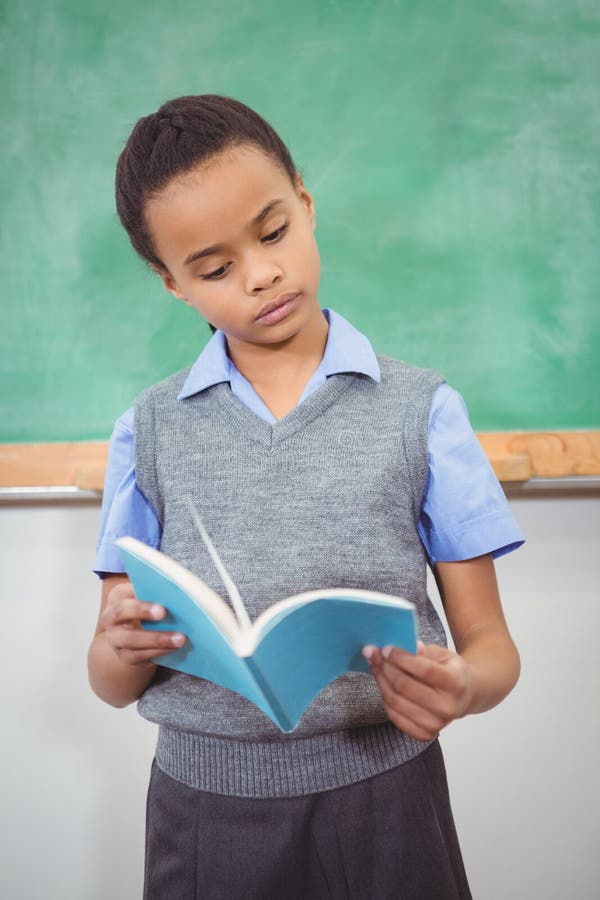 Smart Student Holding a Book Standing in a Library Stock Image - Image ...