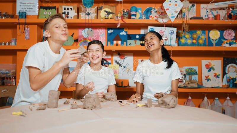 Smart Student Using Hand Press on Clay Piece at Pottery Workshop ...