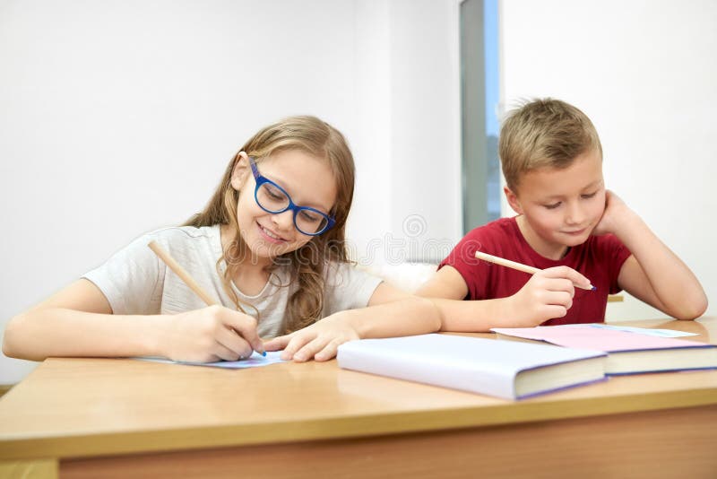 Smart Students Sitting in Classroom and Doing Test at School Stock ...