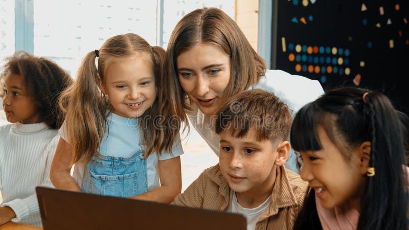 Caucasian Teacher Checking Student Answer while Learner Using Laptop ...
