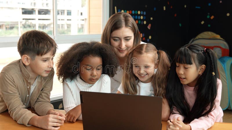 Caucasian Teacher Checking Student Answer while Learner Using Laptop ...