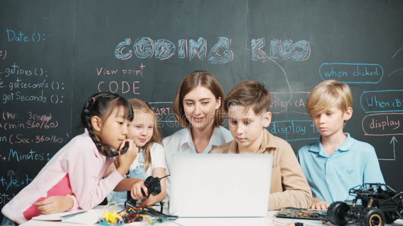 Smart Teacher and Diverse Student Looking at Laptop at Blackboard ...