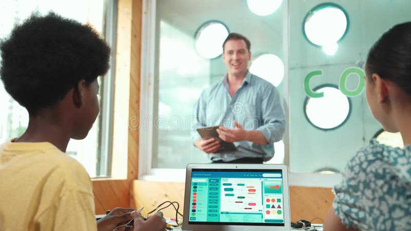 Smart Teacher Hold Tablet while Back View Student Learning Code. Edification Stock Video - Video ...