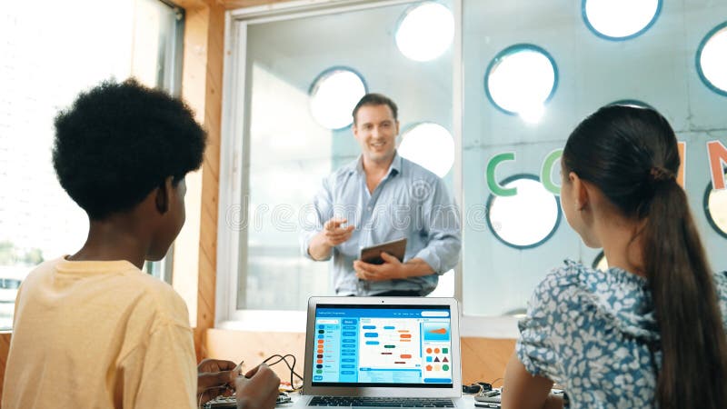Smart Teacher Hold Tablet while Back View Student Learning Code ...