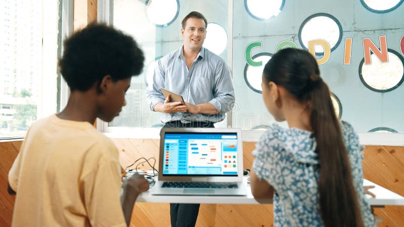 Smart Teacher Hold Tablet while Back View Student Learning Code ...